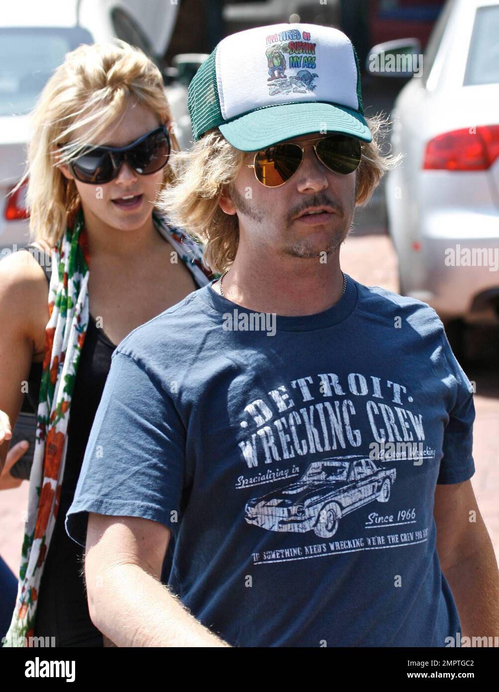 David Spade pokes at a dog while he's out and about in Malibu wearing ...