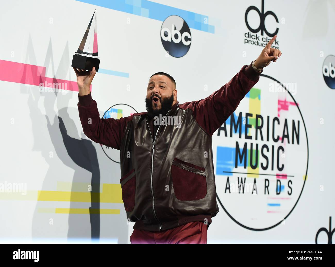 DJ Khaled poses in the press room with the award for favorite song rap ...