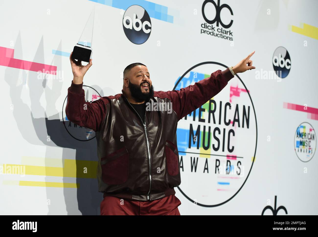 DJ Khaled poses in the press room with the award for favorite song rap ...
