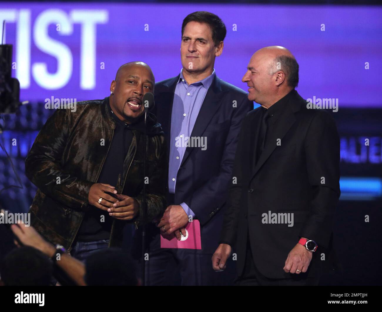Daymond John, from left, Mark Cuban, and Kevin O'Leary present the ...