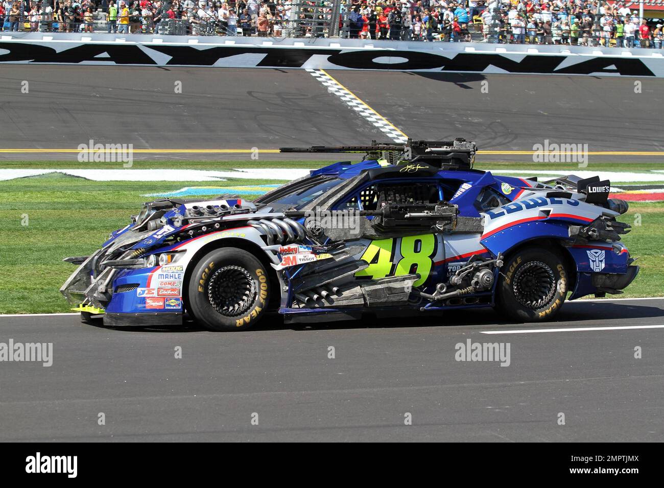 A NASCAR Transformer car is driven down pit road prior to the start of ...