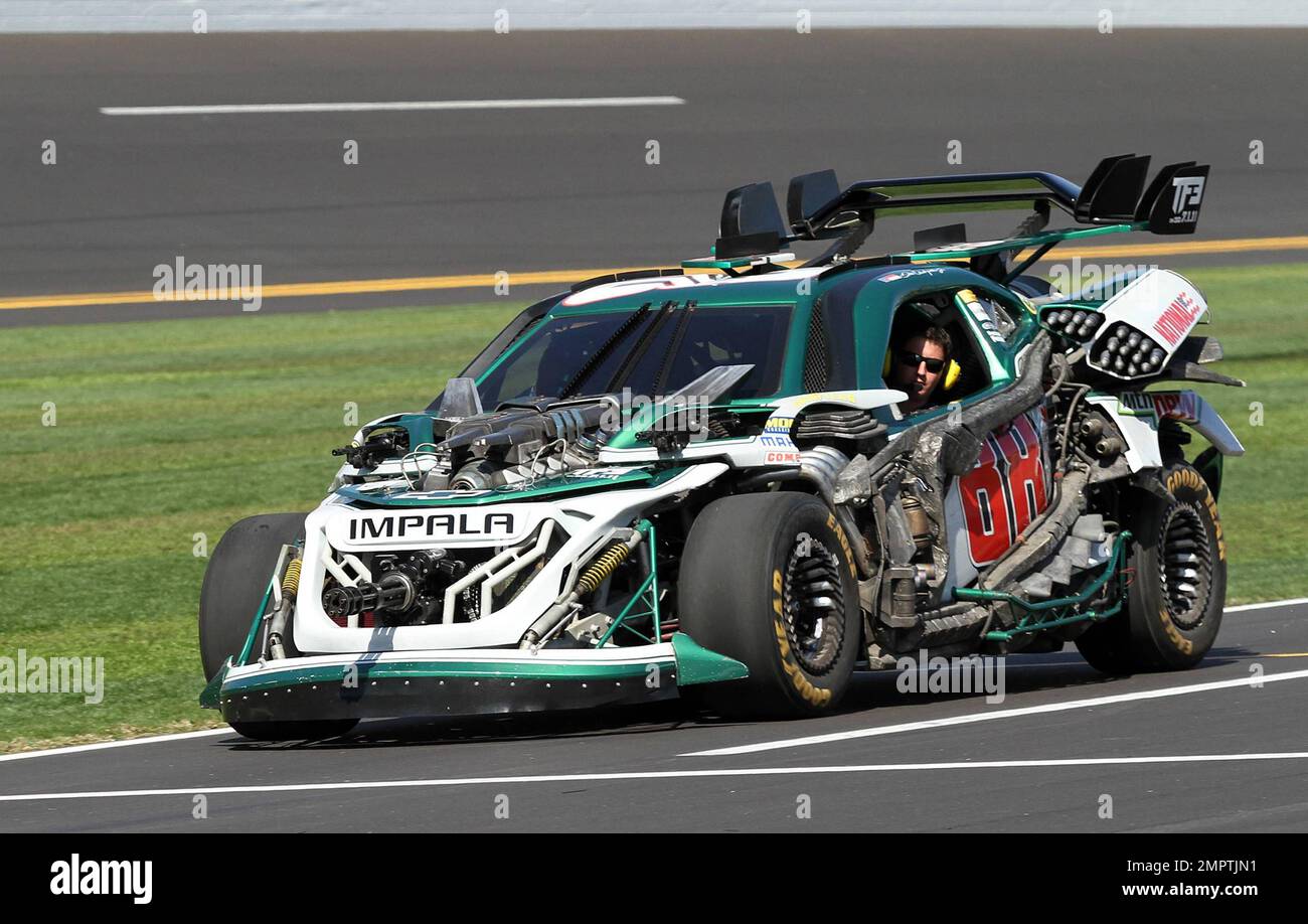 A NASCAR Transformer car is driven down pit road prior to the start of ...