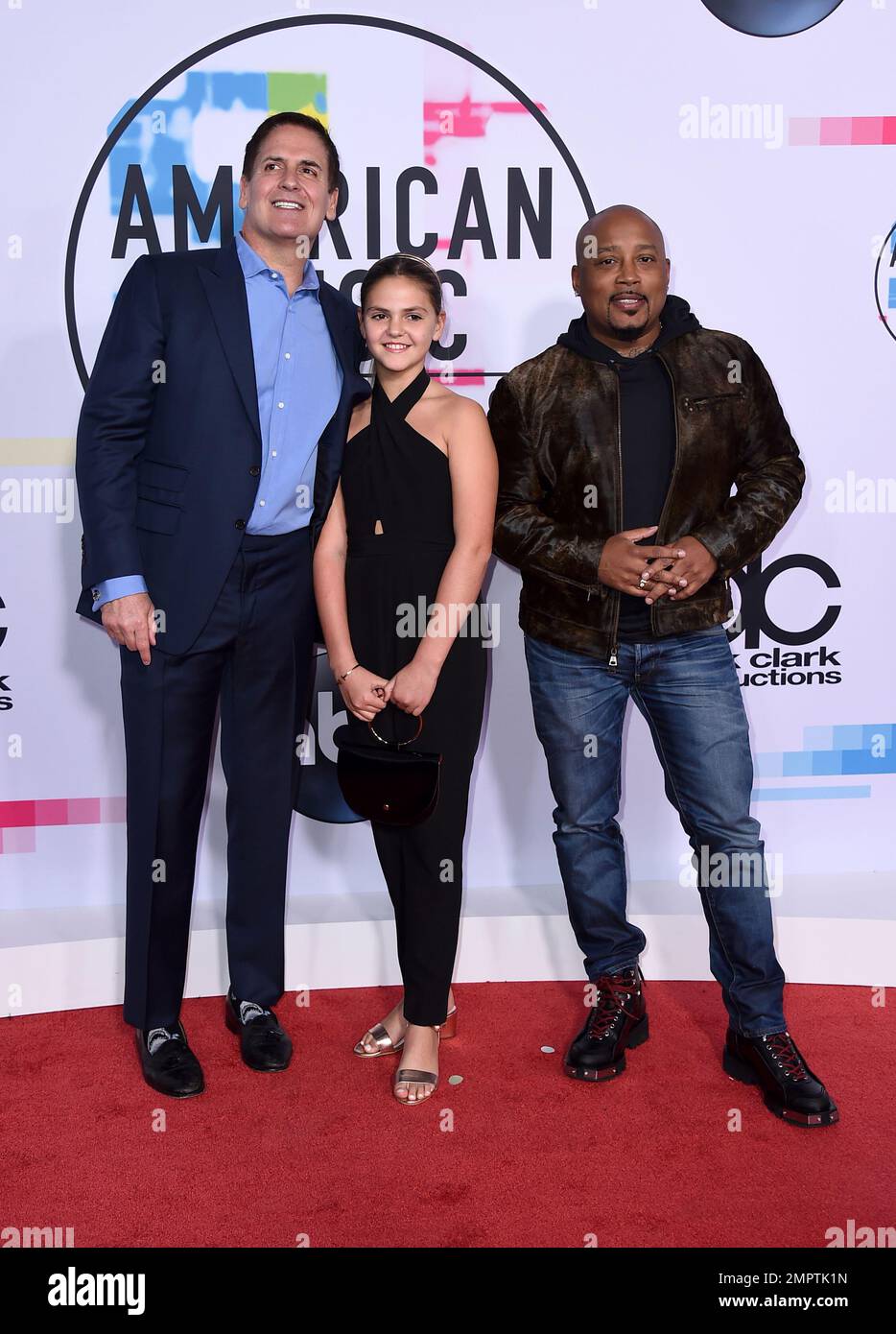 Mark Cuban, from left, Alyssa Cuban, and Daymond John arrive at the ...