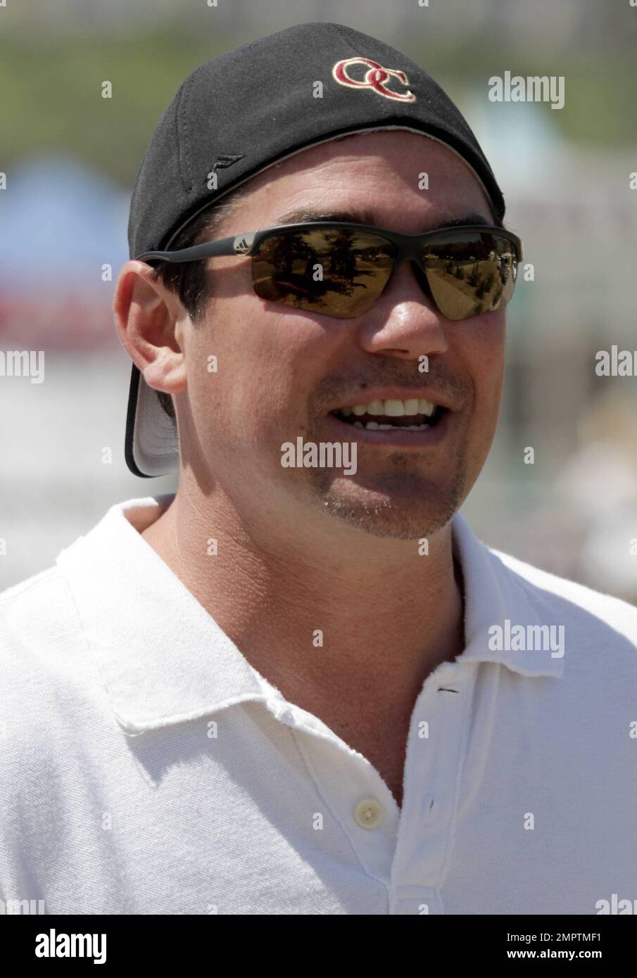 Dean Cain looks casual in a black cap turned backwards, white shirt and ...