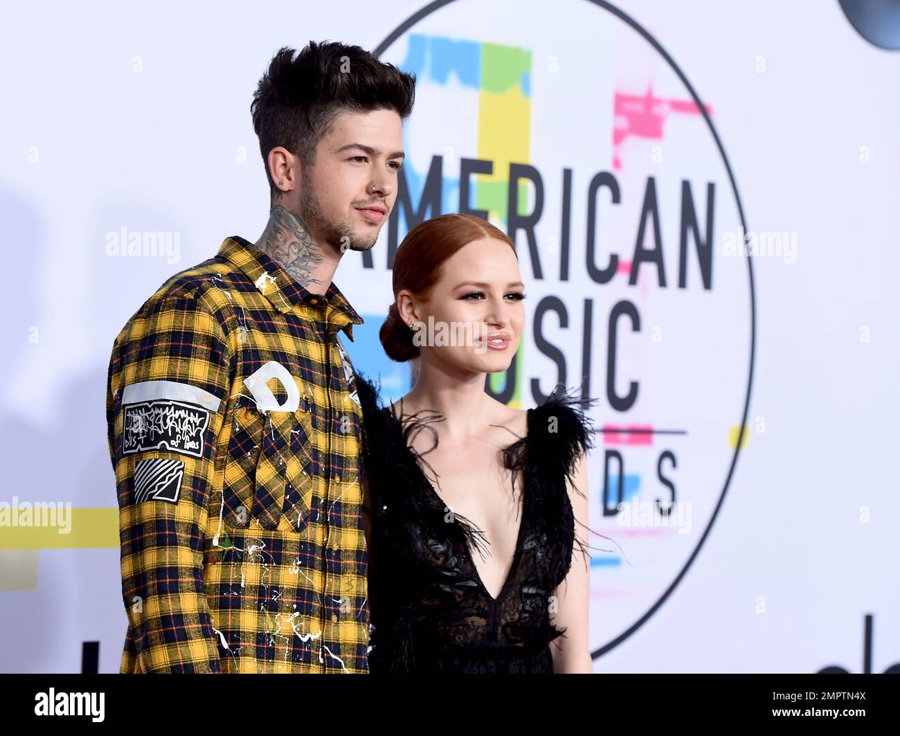 Madelaine Petsch, right, and Travis Miller arrive at the American Music ...