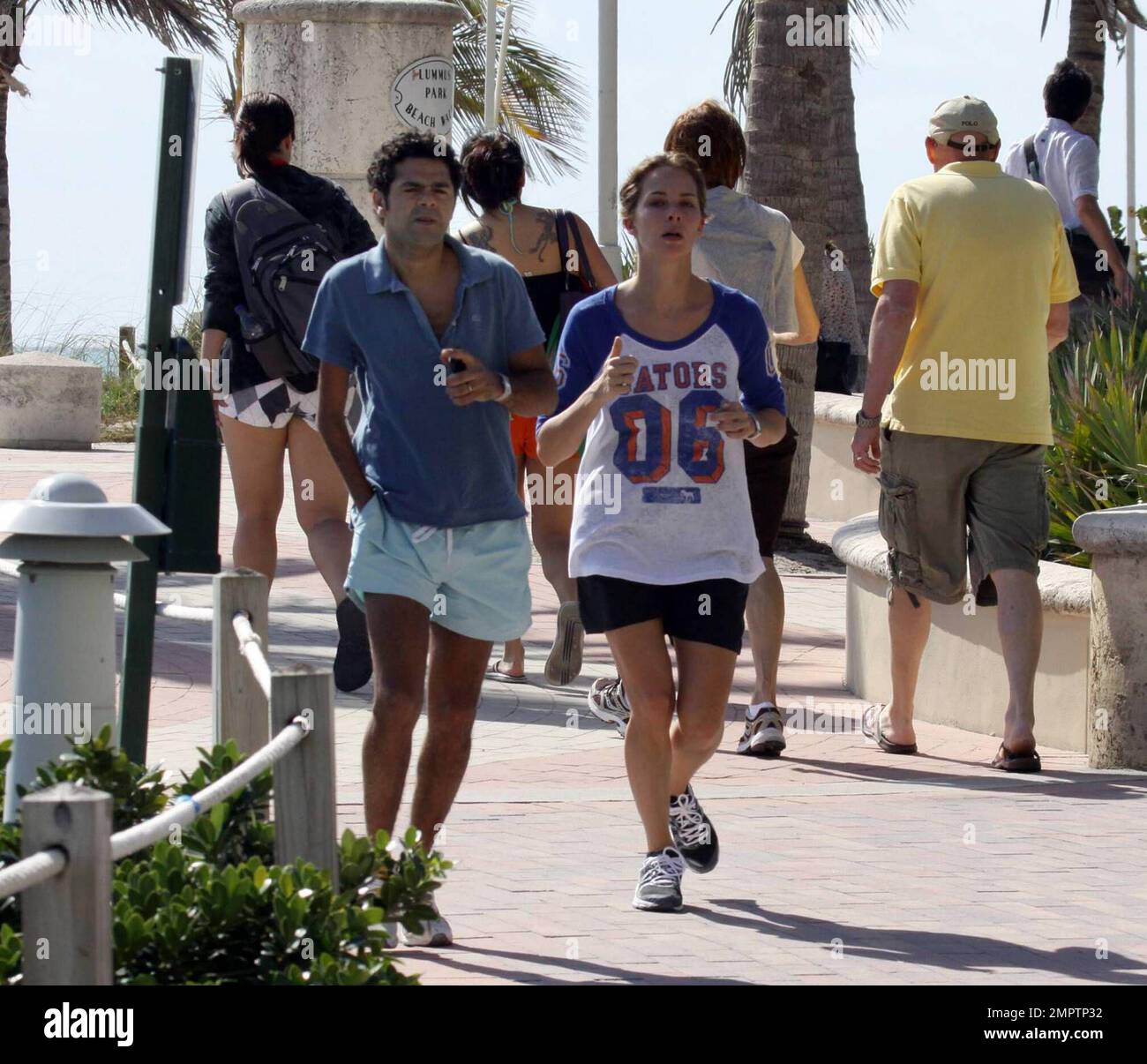Jamel Debbouze and Melissa Theuriau go for a jog. Debbouze's legs show ...
