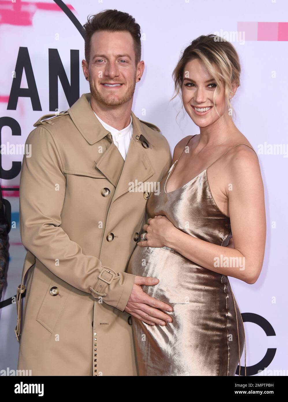 Tyler Hubbard, left, and Hayley Stommel arrive at the American Music ...