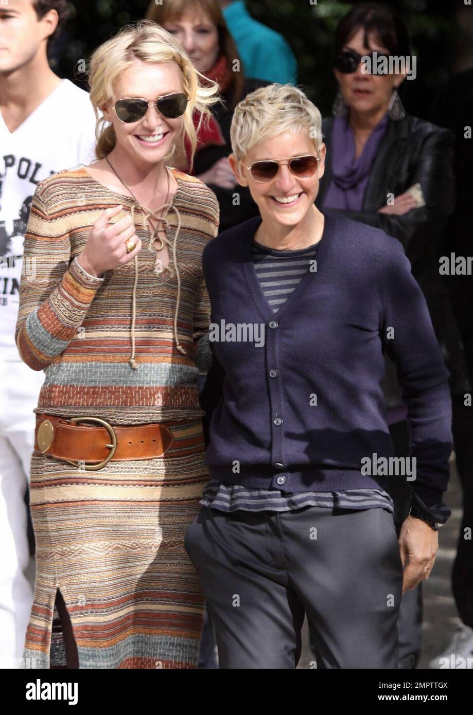 Former Oscar host Ellen DeGeneres and wife Portia De Rossi smile and ...