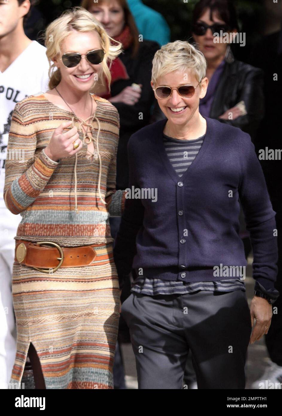 Former Oscar host Ellen DeGeneres and wife Portia De Rossi smile and ...