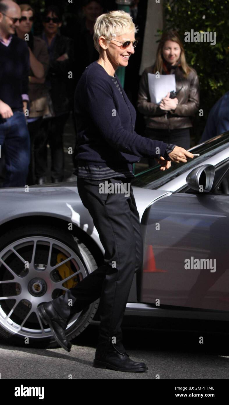 Former Oscar host Ellen DeGeneres and wife Portia De Rossi smile and ...