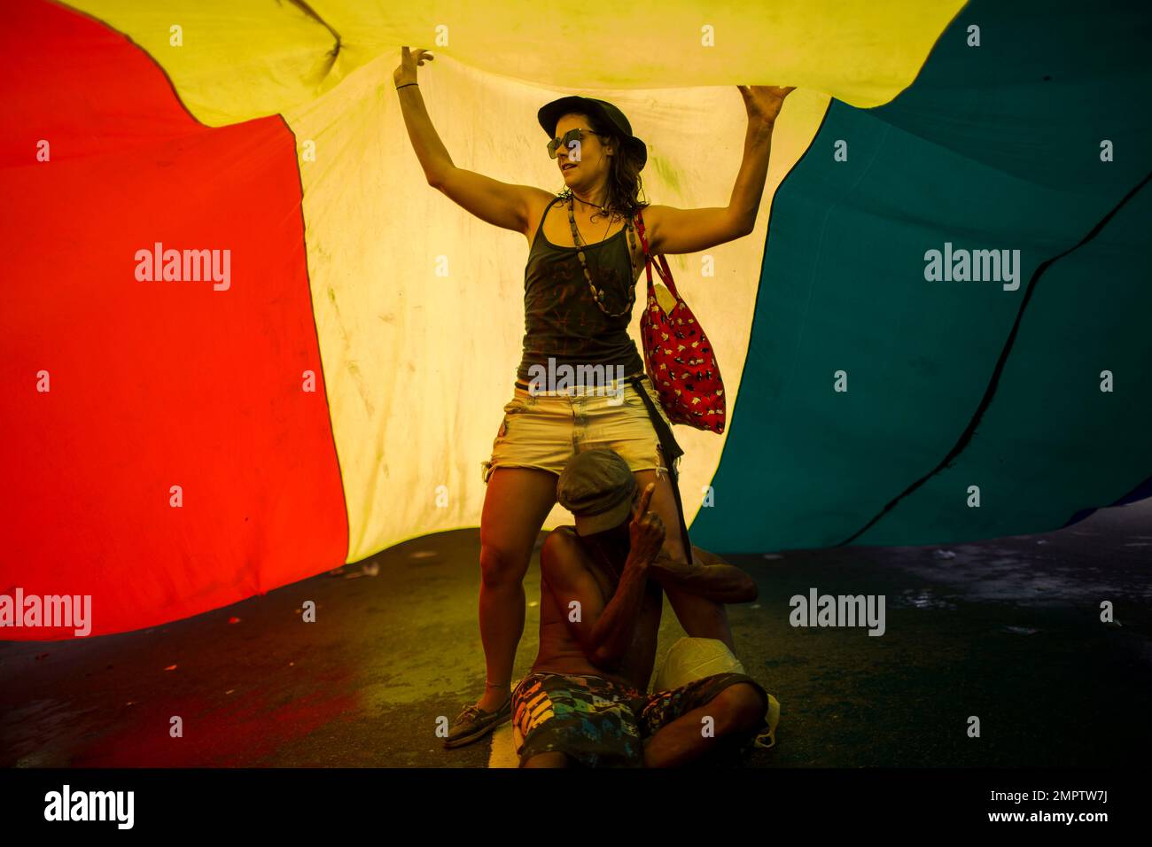 People dance under the LGBT flag during the Gay Pride Parade at ...