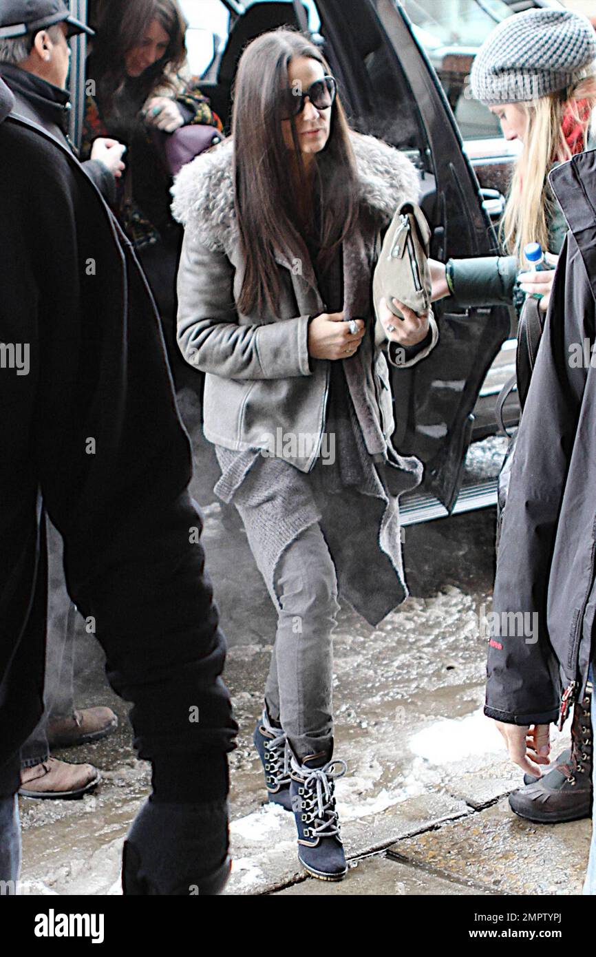 Demi Moore keeps warm in a grey jacket, jeans and lace-up boots while ...