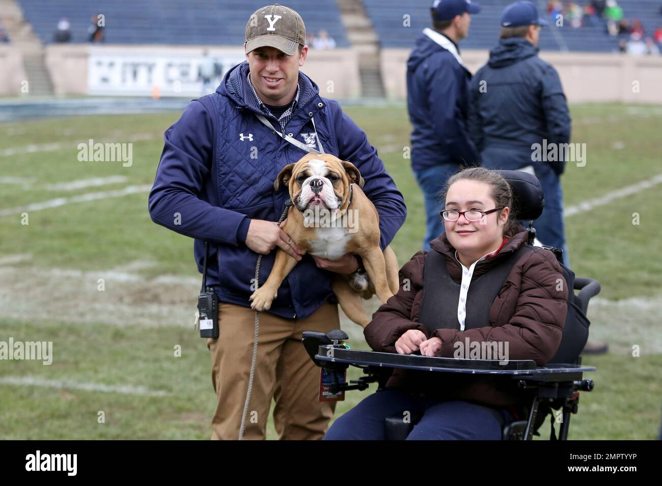 Yale mascot Handsome Dan poses with a fan on the sidelines before ...