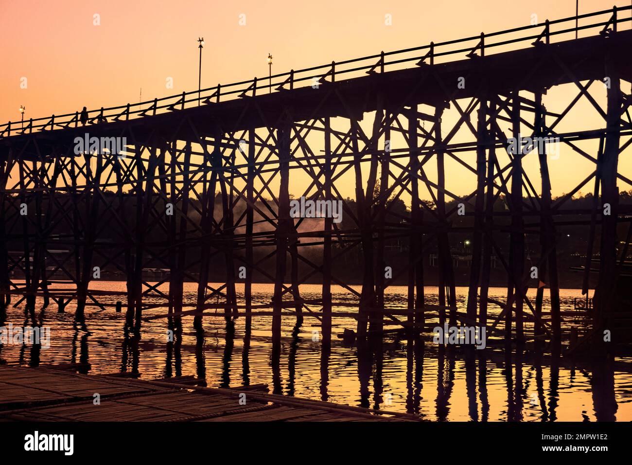 The Wooden Mon Bridge (Uttamanusorn Bridge) at sunset, Sangkhlaburi ...