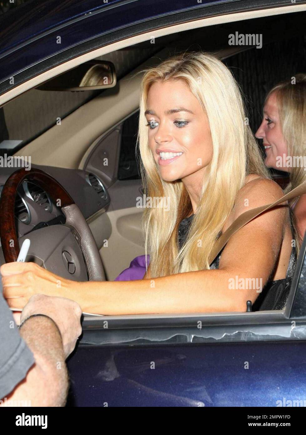 - Actress Denise Richards signs autographs for fans as she leaves the ...