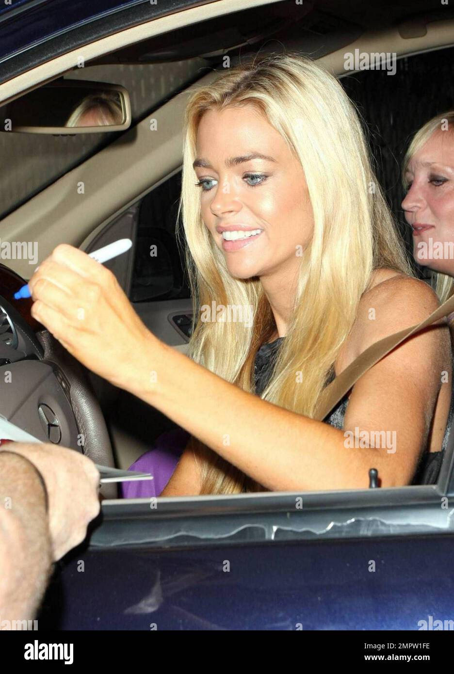 - Actress Denise Richards signs autographs for fans as she leaves the ...
