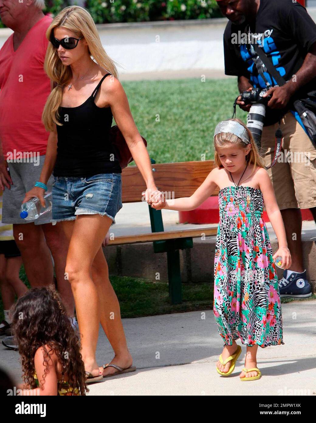 Actress Denise Richards and her father head out for a day of shopping with her two daughters ...
