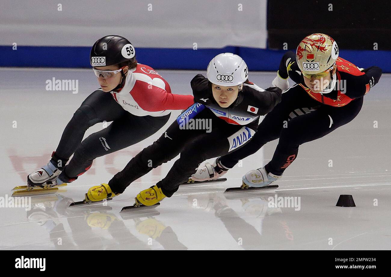 Japan's Hitomi Saito, center, competes against Canada's Jamie Macdonald ...