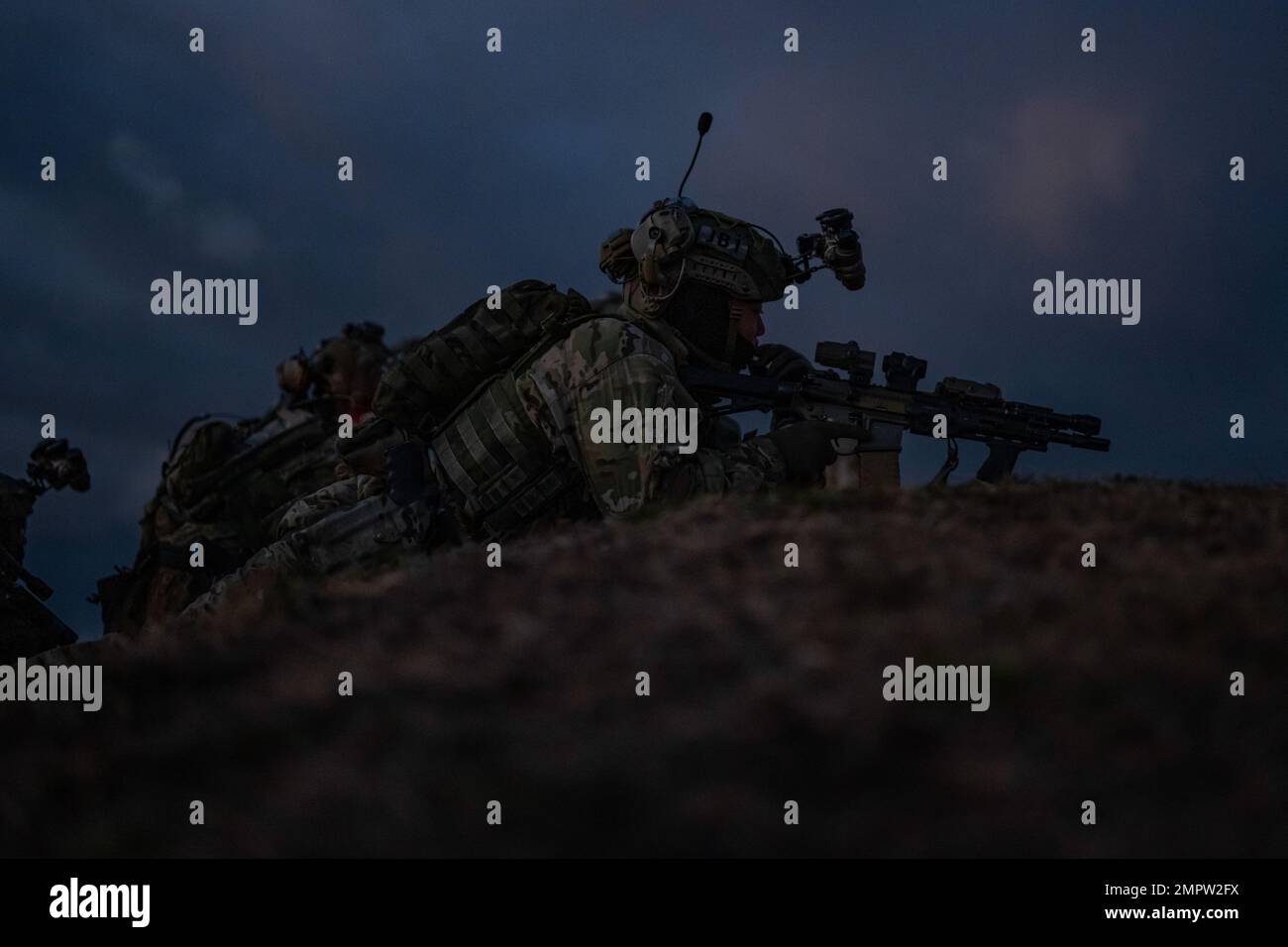 A Japan Self-Defense Forces (JSDF) member establishes a defensive ...