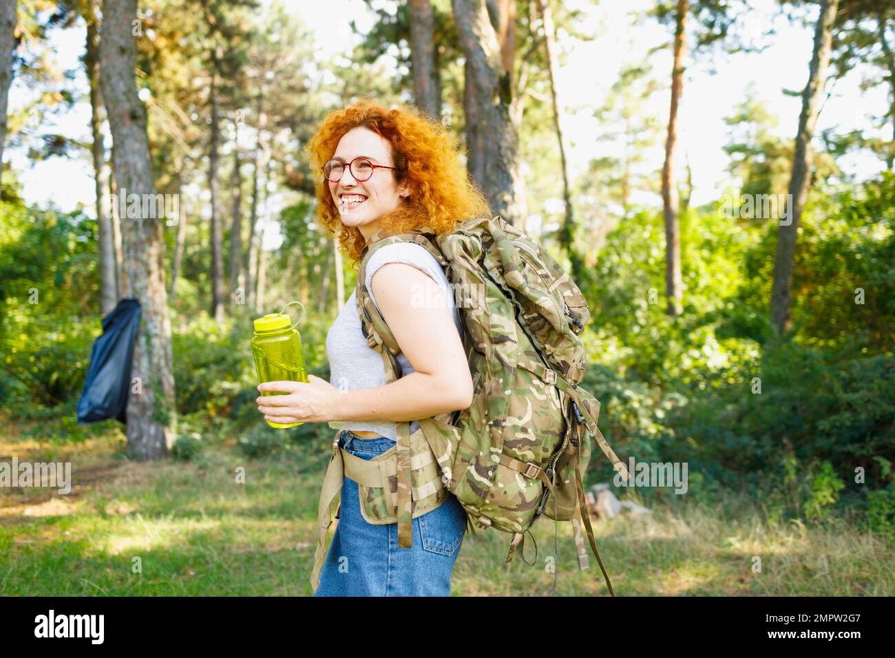 Happy woman backpacking during the spring Stock Photo - Alamy