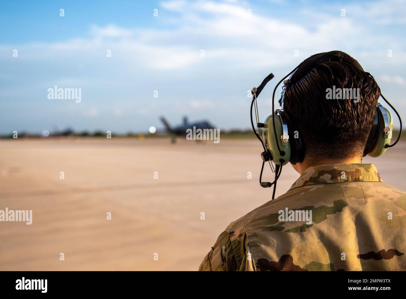 U.S. Air Force Airmen watch F-35 Lightning IIs return to their hangars ...