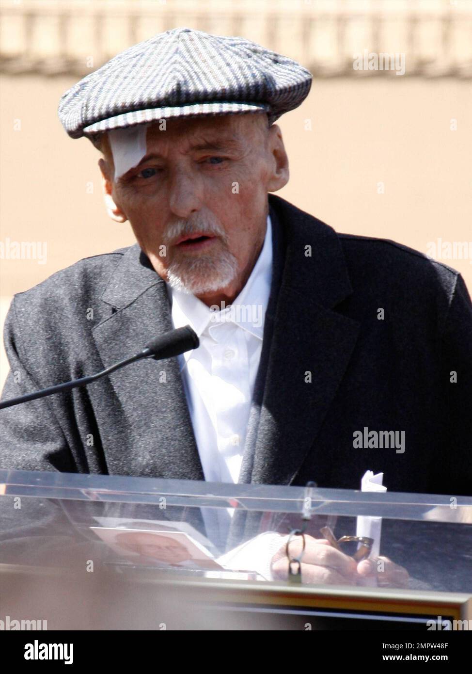A frail looking Dennis Hopper is awarded a star on the Hollywood Walk ...