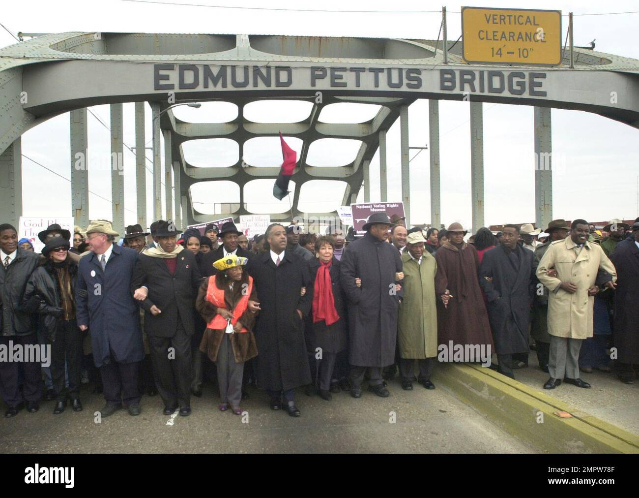FILE - In this Sunday, March 3, 2002 file photo, demonstrators cross ...