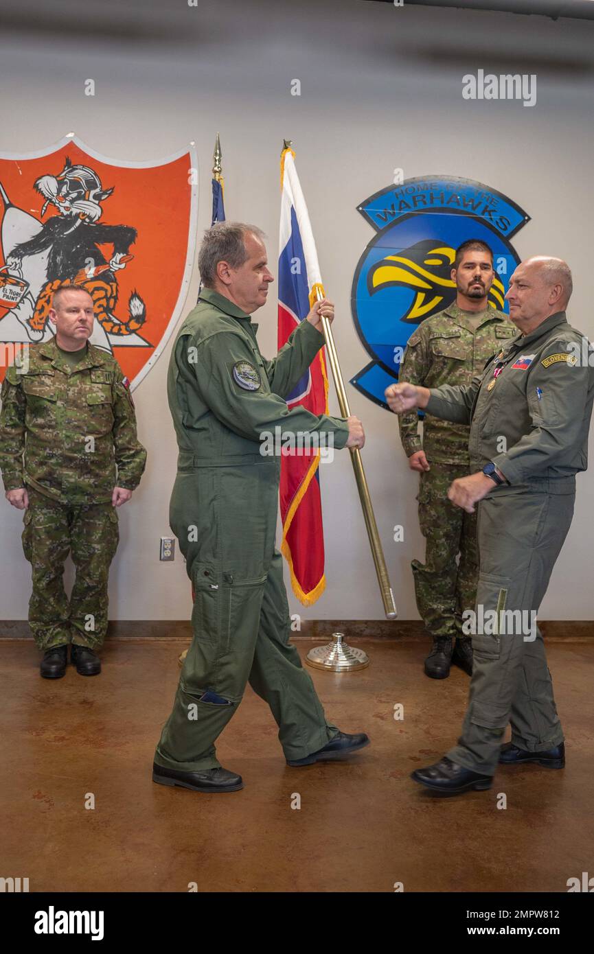 Slovak air force Colonel Adolf Ulicny receives the Slovakian flag from ...