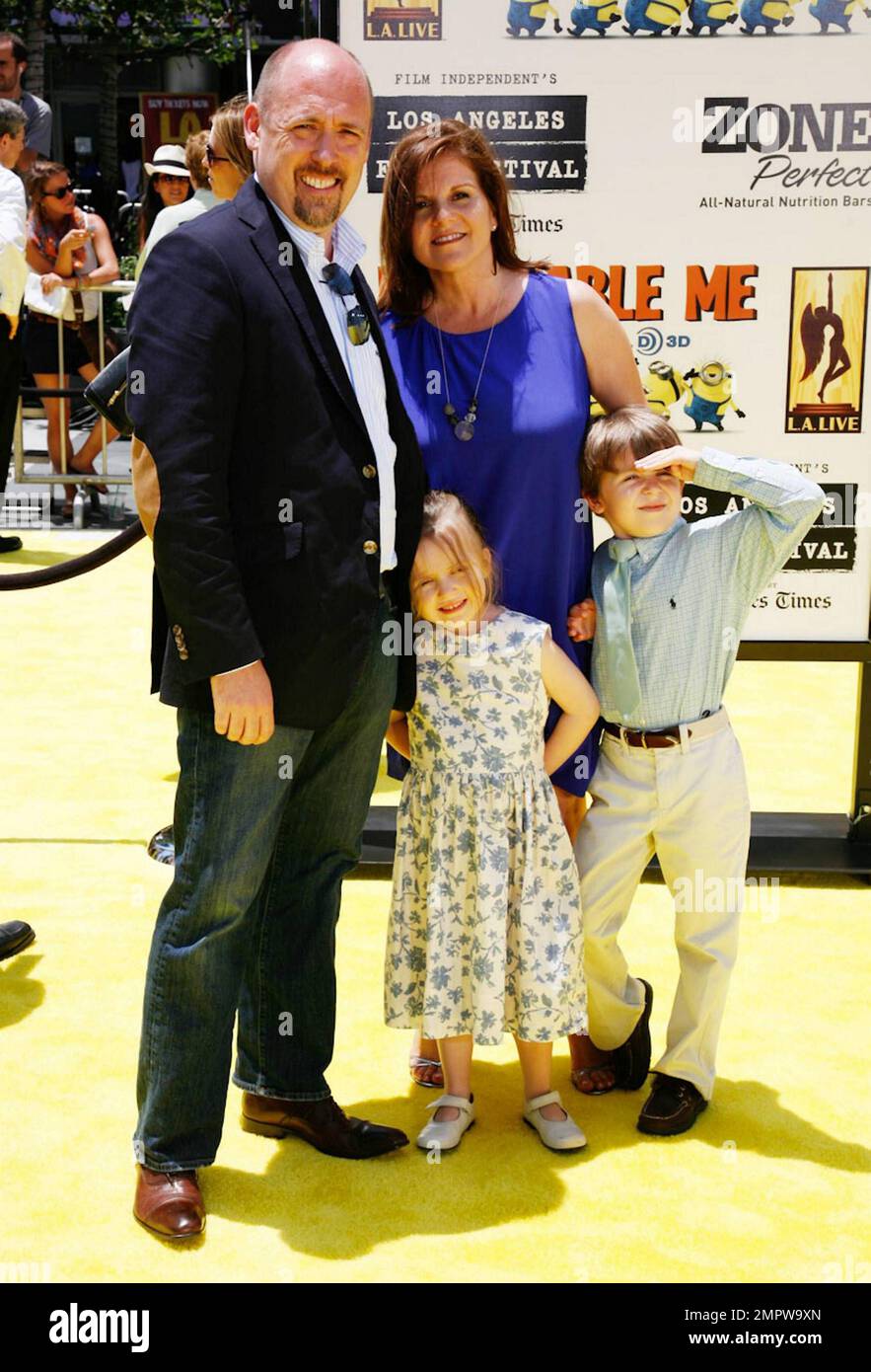 Director Chris Renaud and family pose on the yellow carpet at the ...