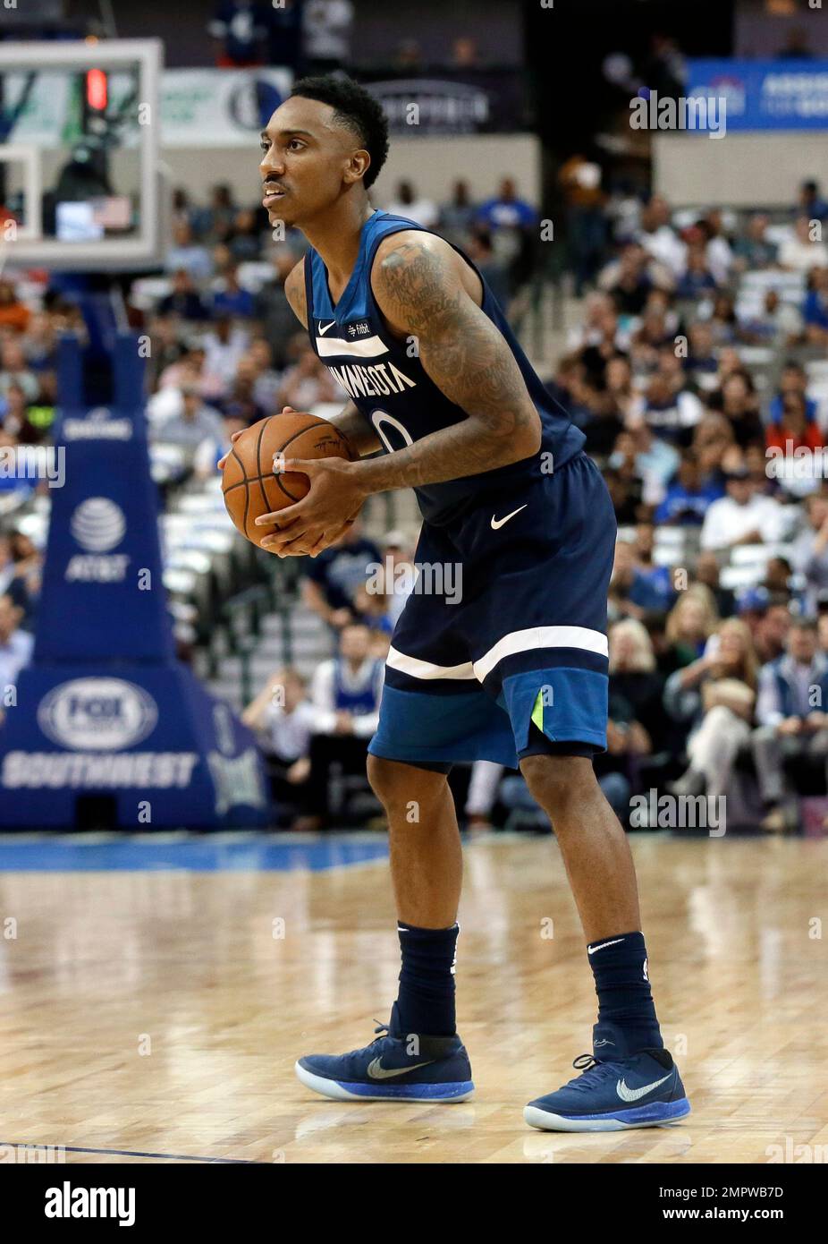 Minnesota Timberwolves guard Jeff Teague (0) handles the ball during an ...
