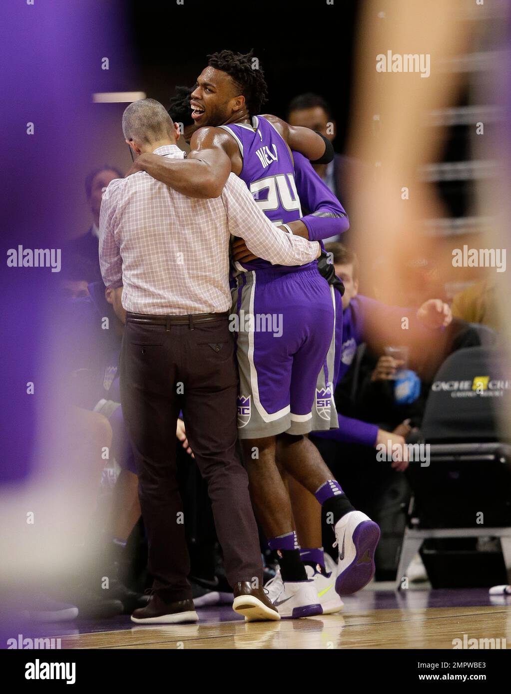 Sacramento Kings guard Buddy Hield is helped to the locker room after ...