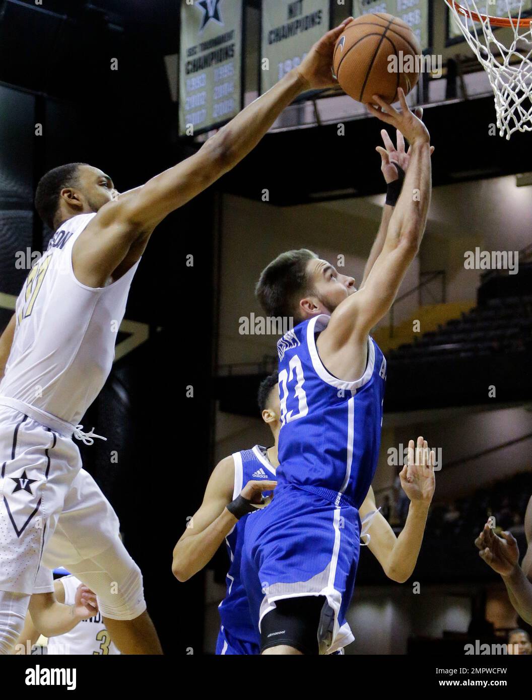 Vanderbilt forward Jeff Roberson, left, bloks a shot by UNC-Asheville ...