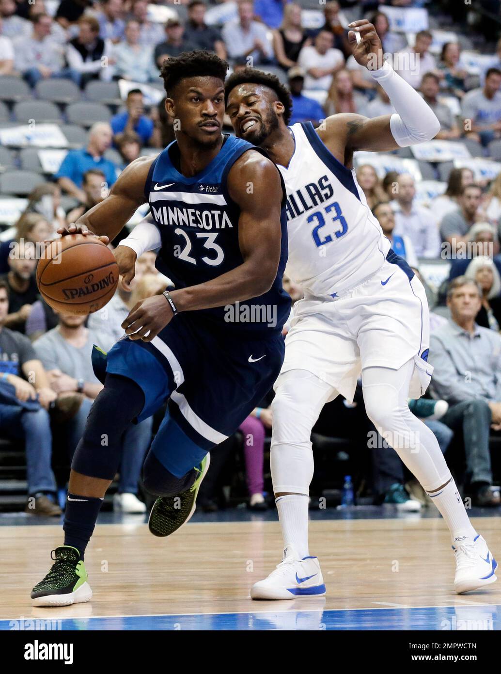 Minnesota Timberwolves guard Jimmy Butler (23) gets past Dallas ...