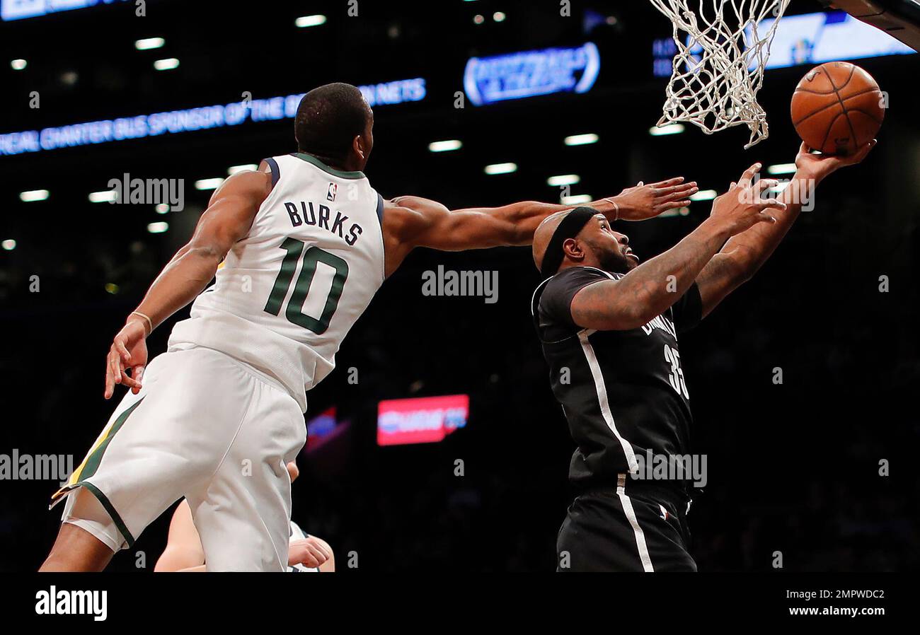 Brooklyn Nets forward Trevor Booker (35) shoots next to Utah Jazz guard ...