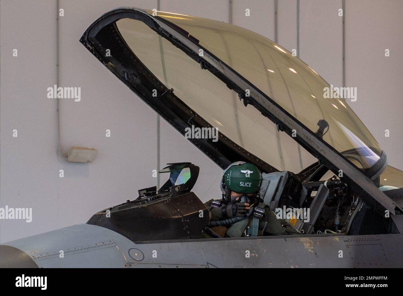 U.S. Air Force Capt. Kim “Slice” Auton, 555th FS F-16 pilot, lowers the ...