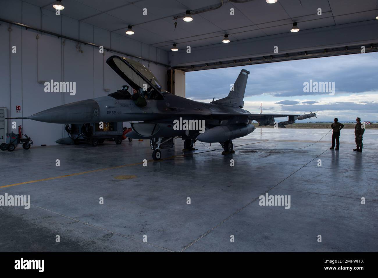 An F-16 Fighting Falcon stands by in a hangar during exercise Falcon Strike 2022 at Amendola Air ...