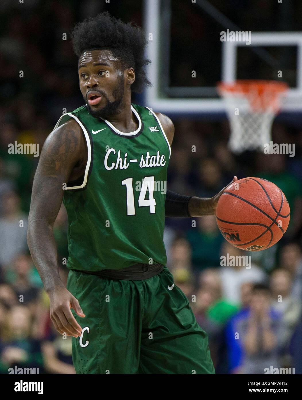 Chicago State's FredSims Jr. (14) brings the ball downcourt during the ...