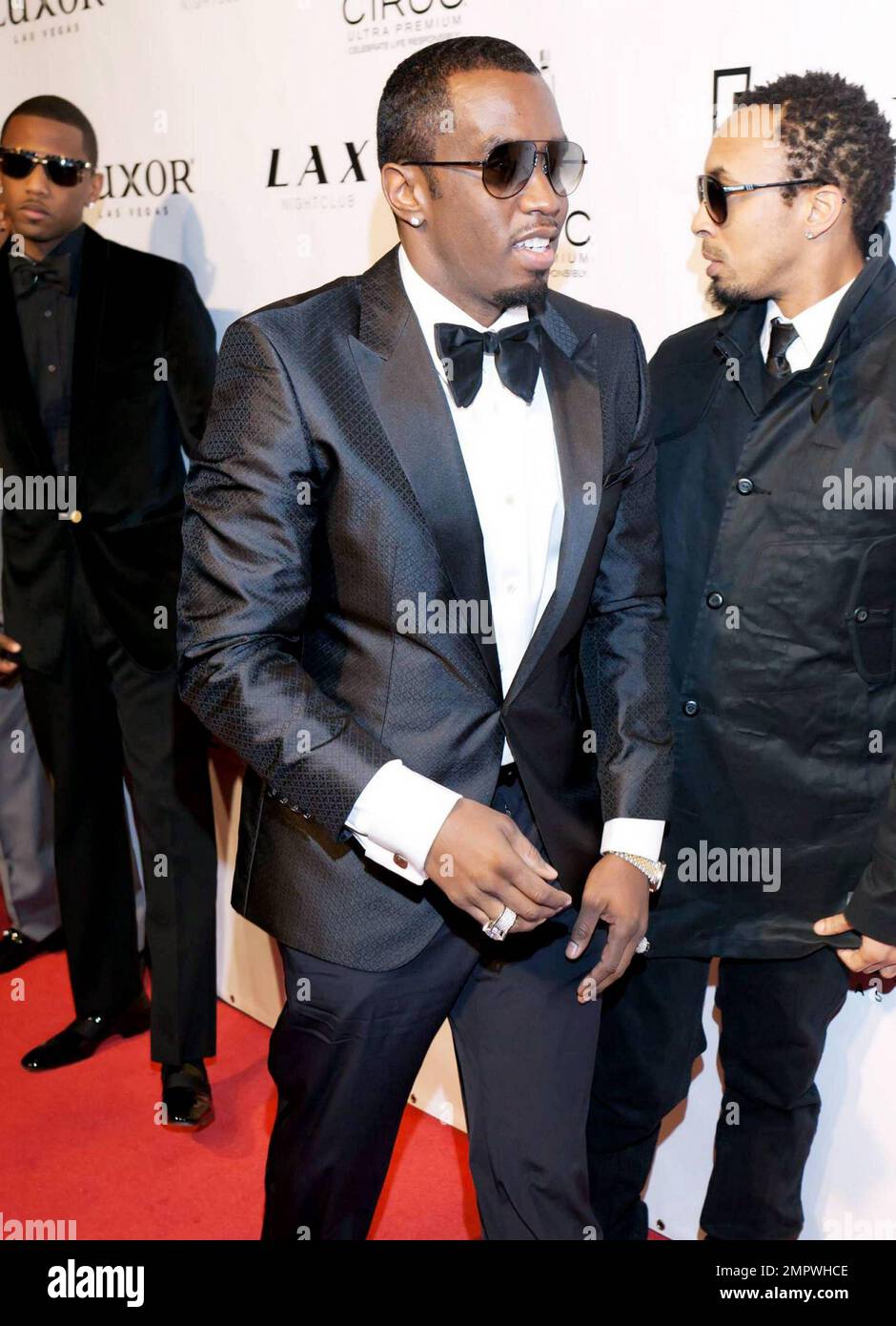 Sean Combs (aka Diddy) shows off his massive diamond rings and flashy ...