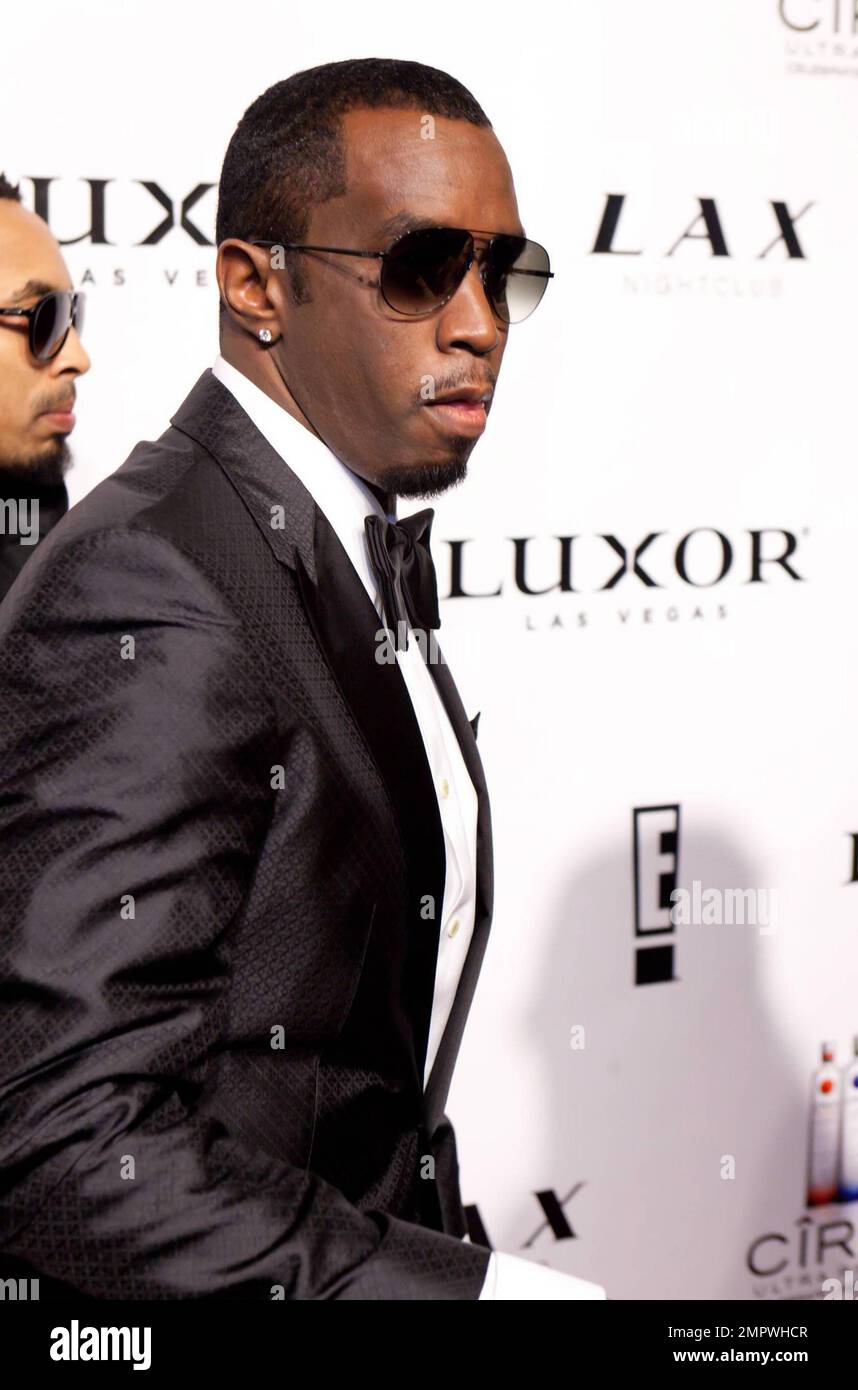 Sean Combs (aka Diddy) shows off his massive diamond rings and flashy ...