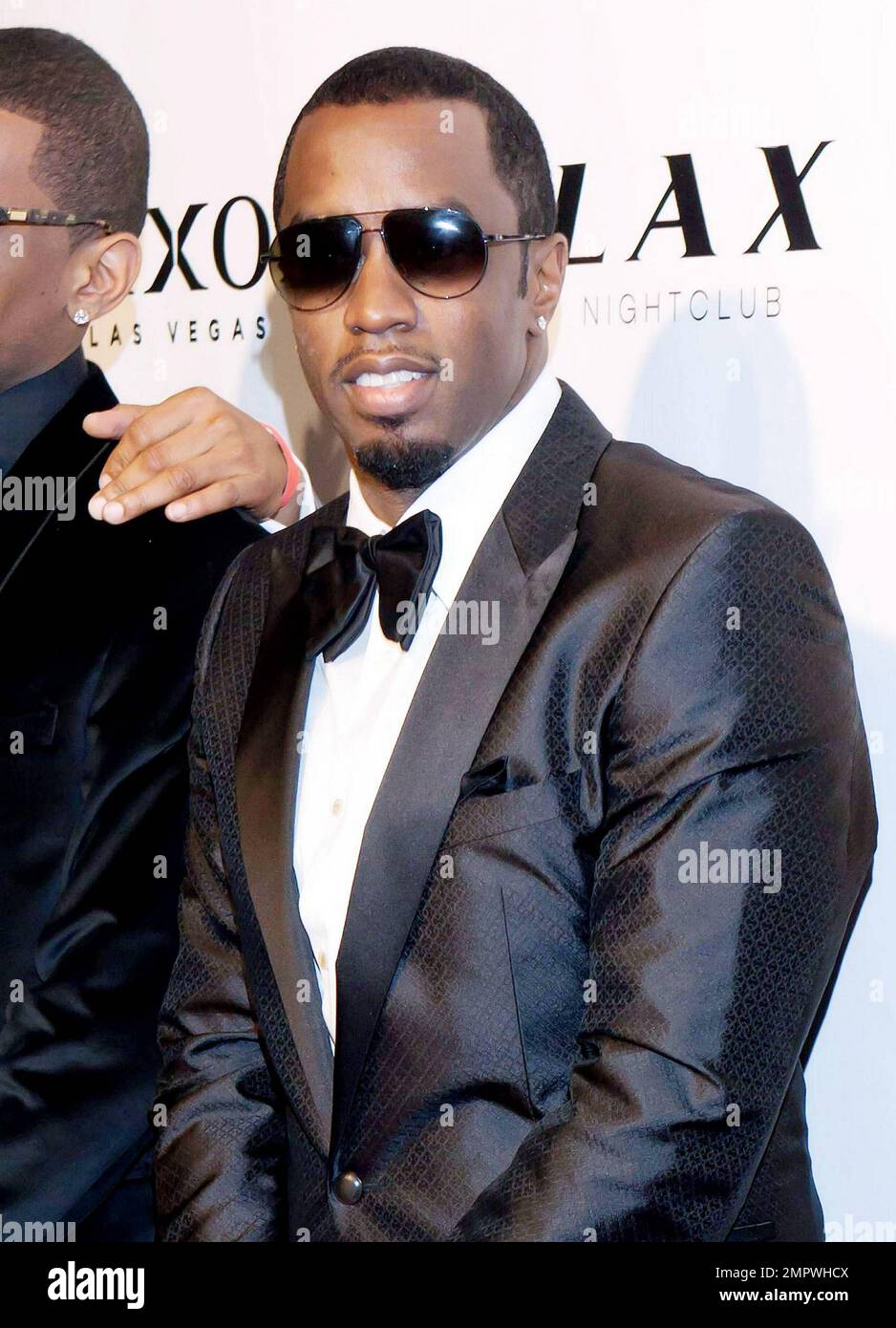 Sean Combs (aka Diddy) shows off his massive diamond rings and flashy tuxedo as he walks the red ...