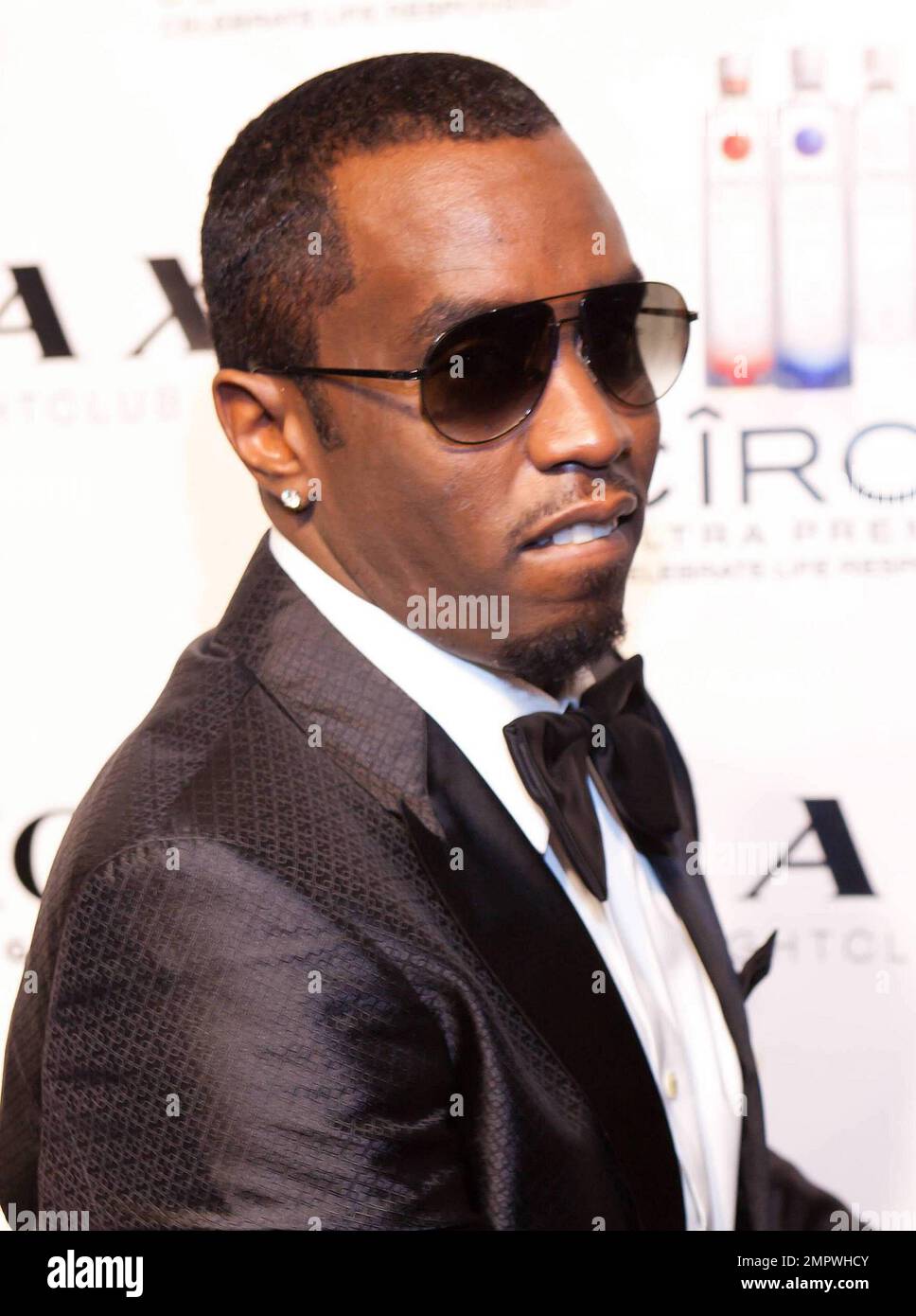 Sean Combs (aka Diddy) shows off his massive diamond rings and flashy ...