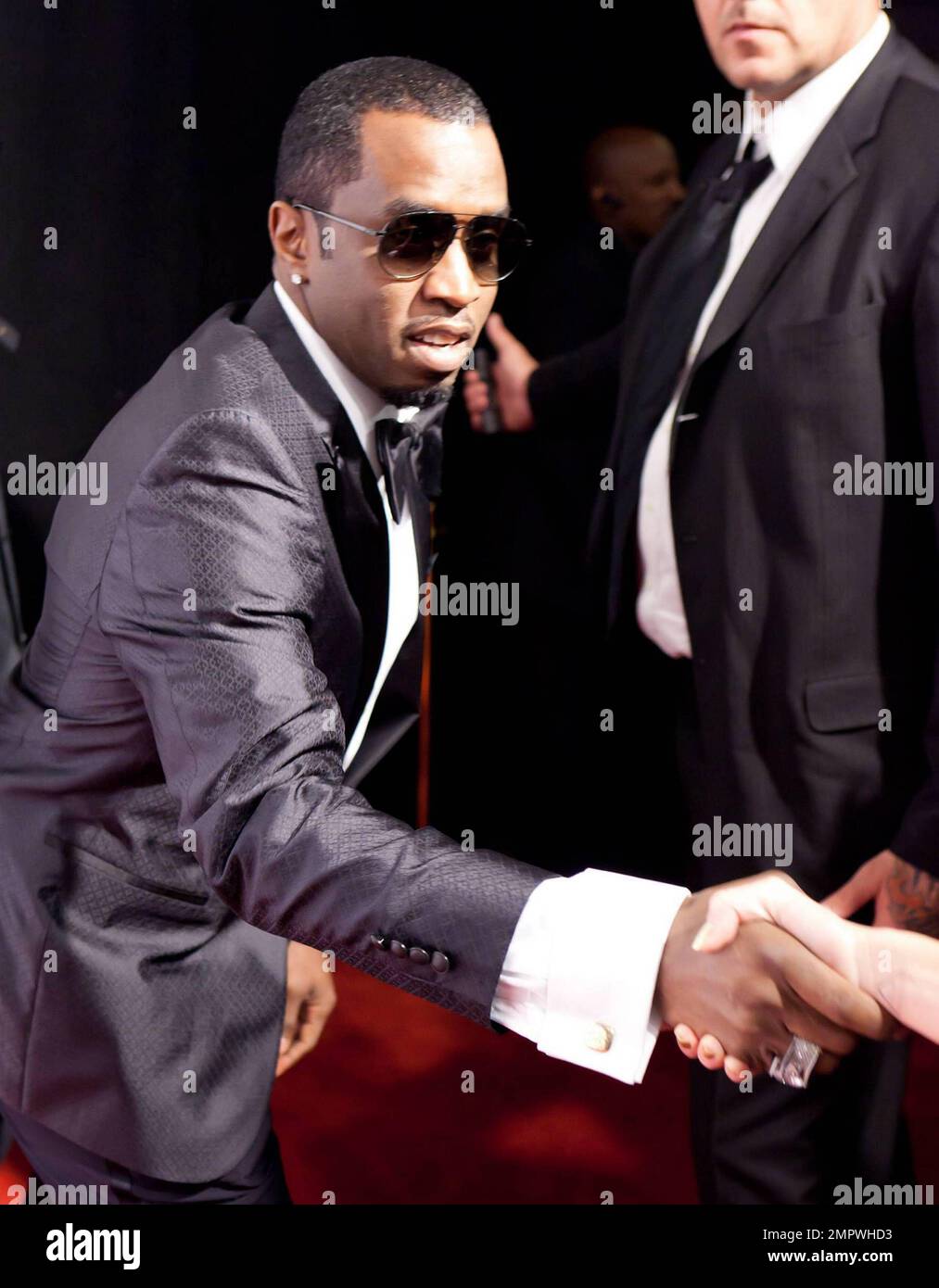 Sean Combs Aka Diddy Shows Off His Massive Diamond Rings And Flashy Tuxedo As He Walks The Red