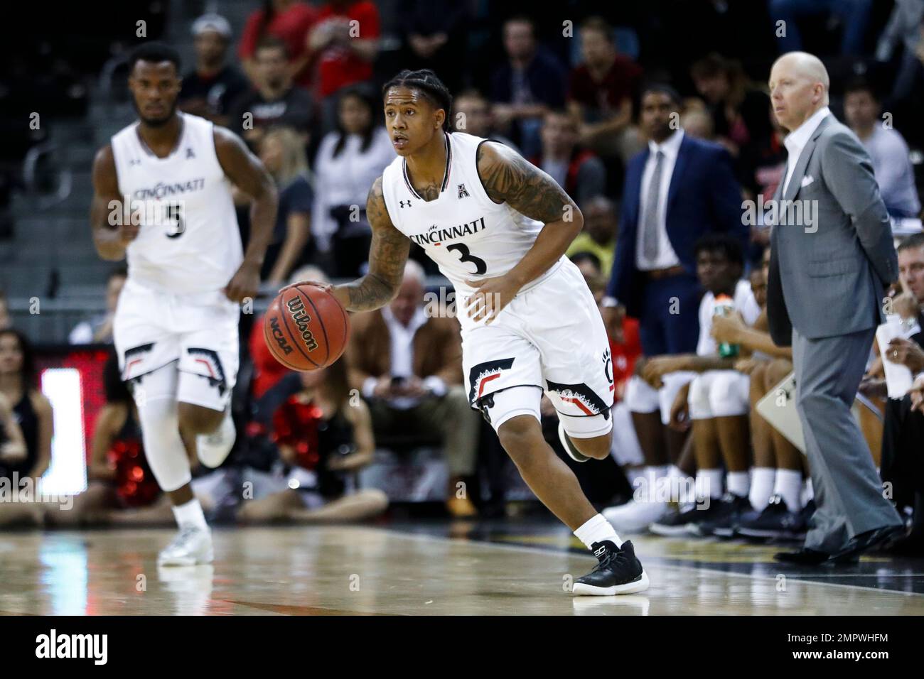 Cincinnati's Justin Jenifer dribbles up the court in the first half of ...
