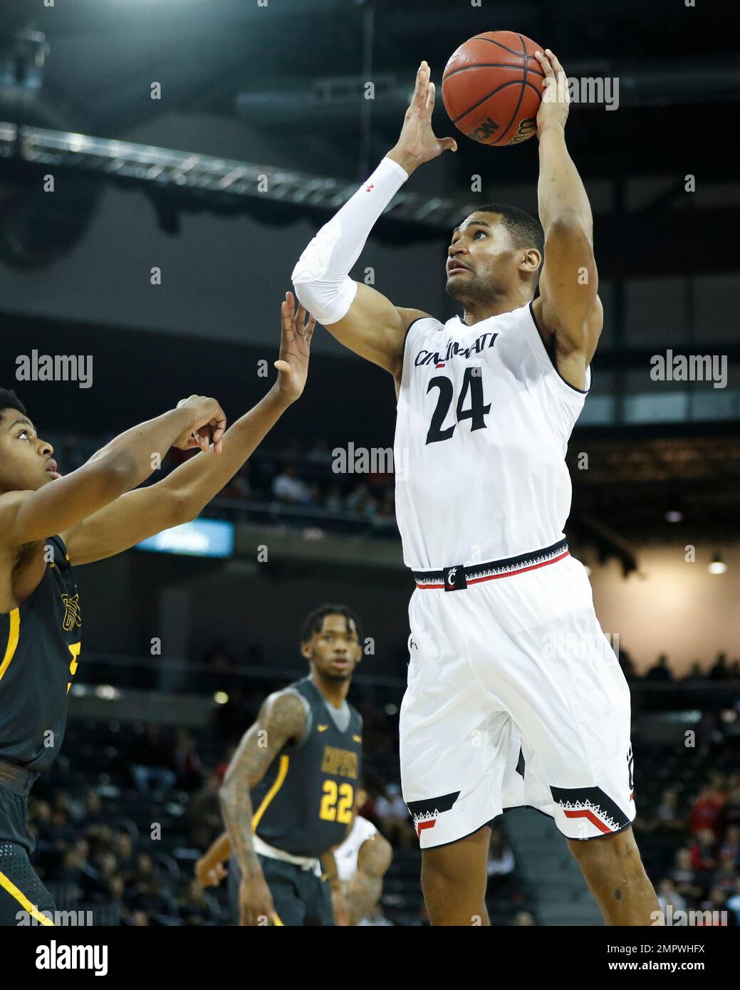 Cincinnati's Kyle Washington (24) shoots over Coppin State's Cedric ...