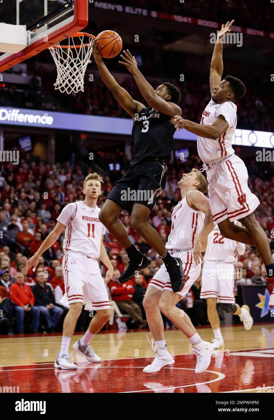 Xavier's Quentin Goodwin (3), Wisconsin's Andy Van Vliet (11), Brevin ...