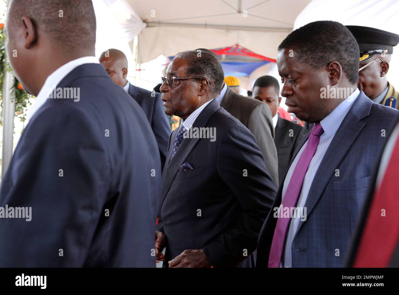 Zimbabwean President Robert Mugabe, center, arrives as he makes his ...