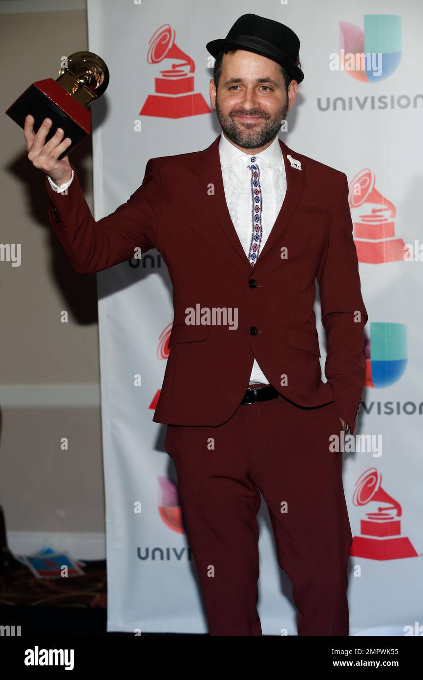 Eduardo Cabra poses in the press room with the award for producer of ...