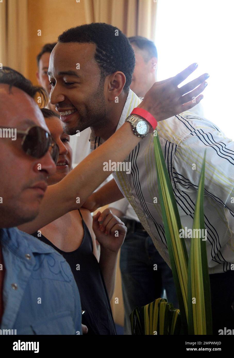 Christine Teigen, John Legend and Designer Neila Granzoti Rudden pose ...