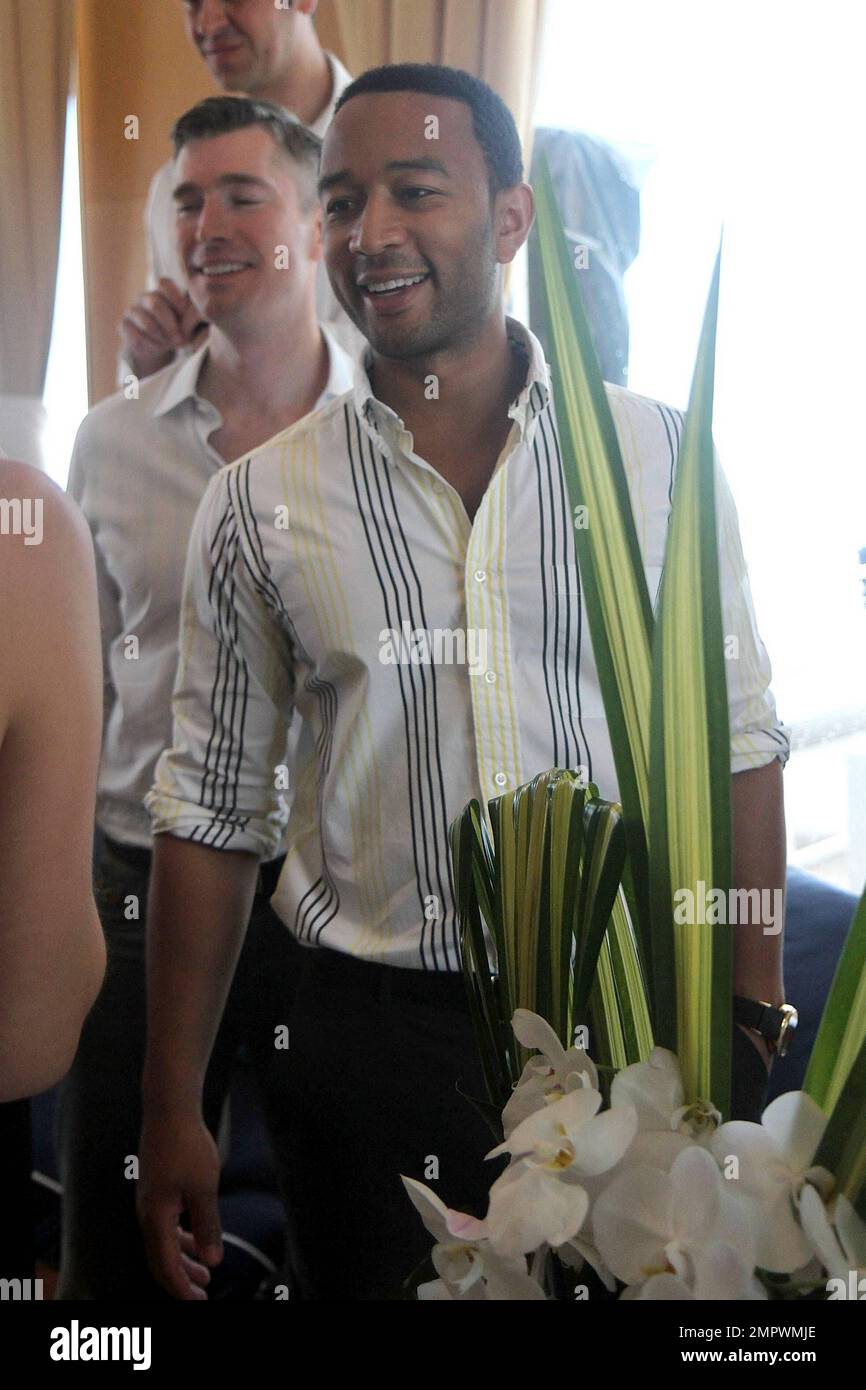 Christine Teigen, John Legend and Designer Neila Granzoti Rudden pose ...