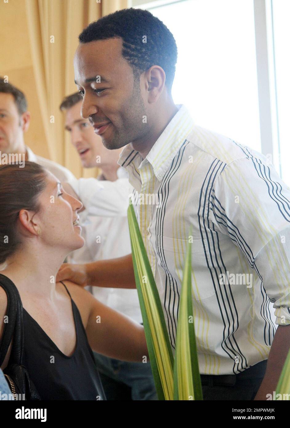Christine Teigen, John Legend and Designer Neila Granzoti Rudden pose ...